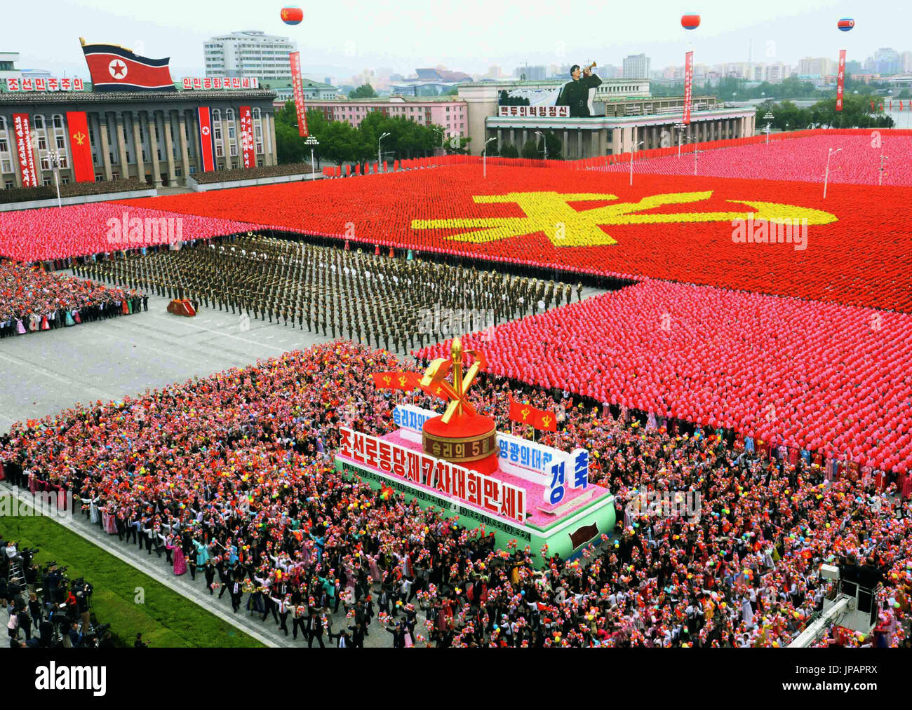 Hundreds of thousands of people take part in a parade in Pyongyang's ...