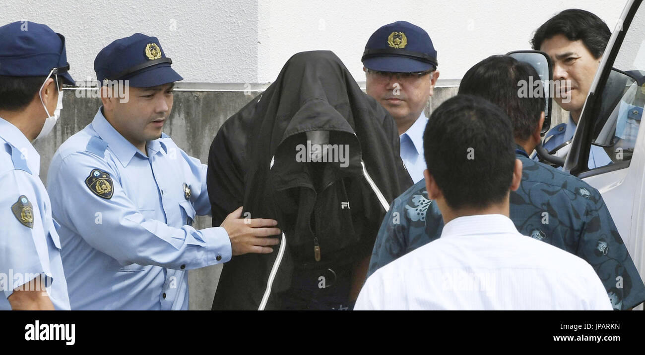 Kenneth Franklin Shinzato (3rd from L), a former U.S. Marine who works at the U.S. Kadena Air ...