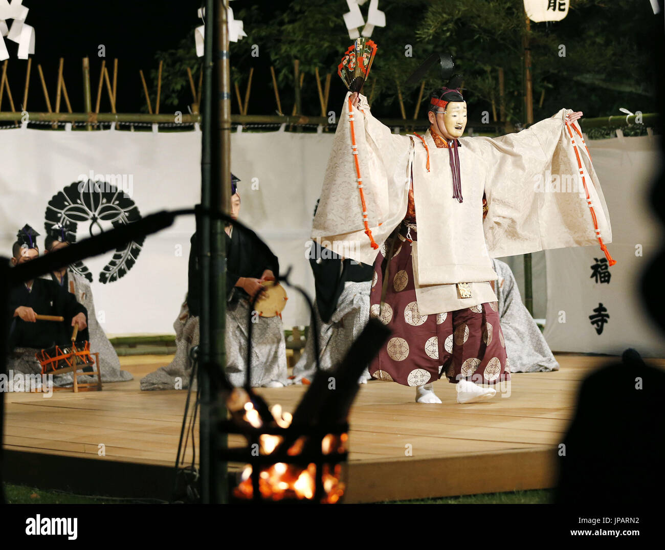 A traditional outdoor Noh play is performed at Kofuku Temple in the ...