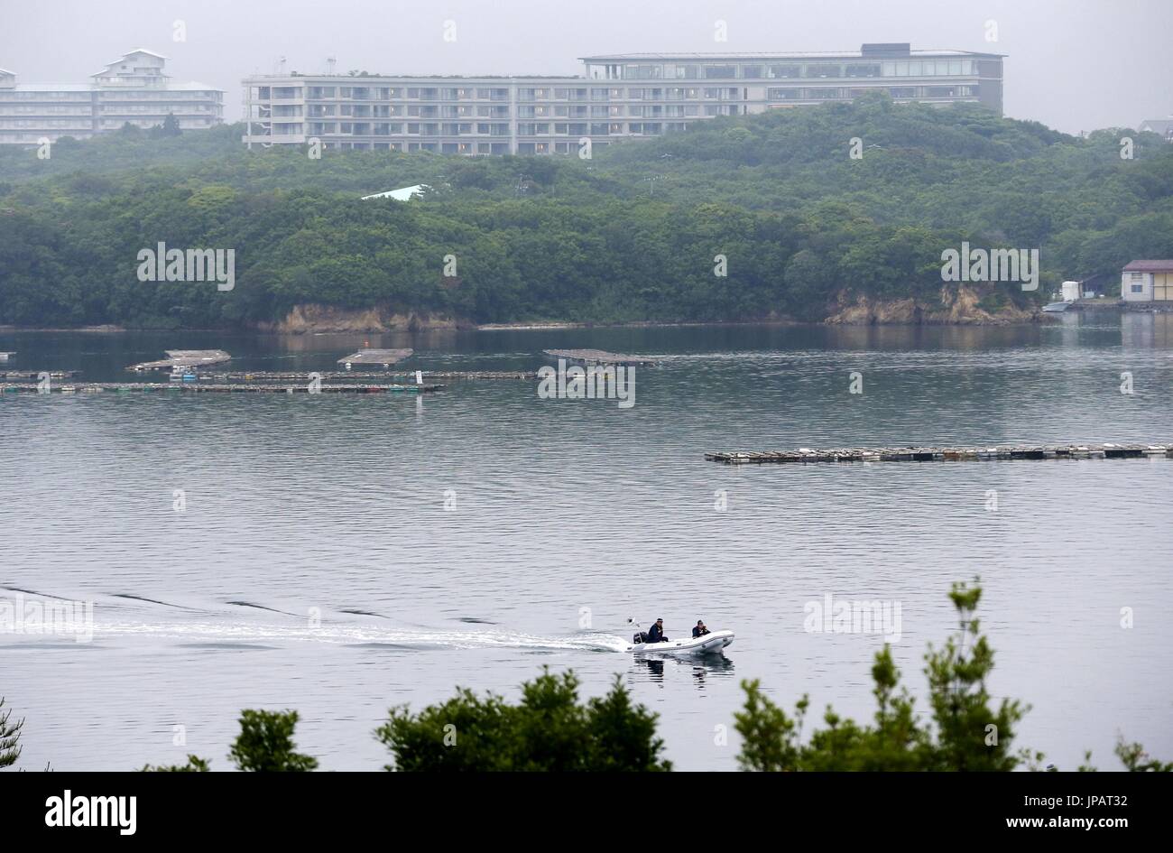 Police officers patrol the area around Kashiko Island in Mie Prefecture ...