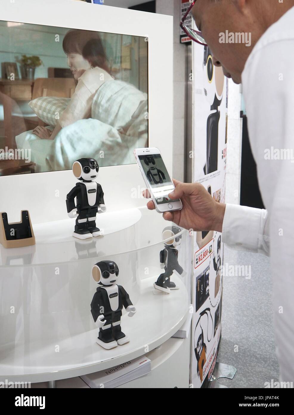 RoBoHoN humanoid robot phones are displayed at a mass retailer in Osaka ...