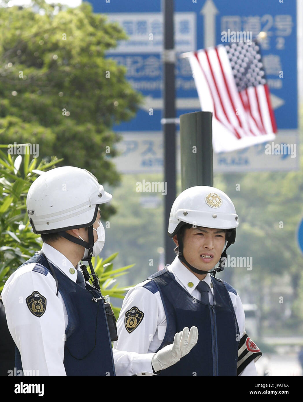 Police officers stand guard around the Peace Memorial Park in the ...