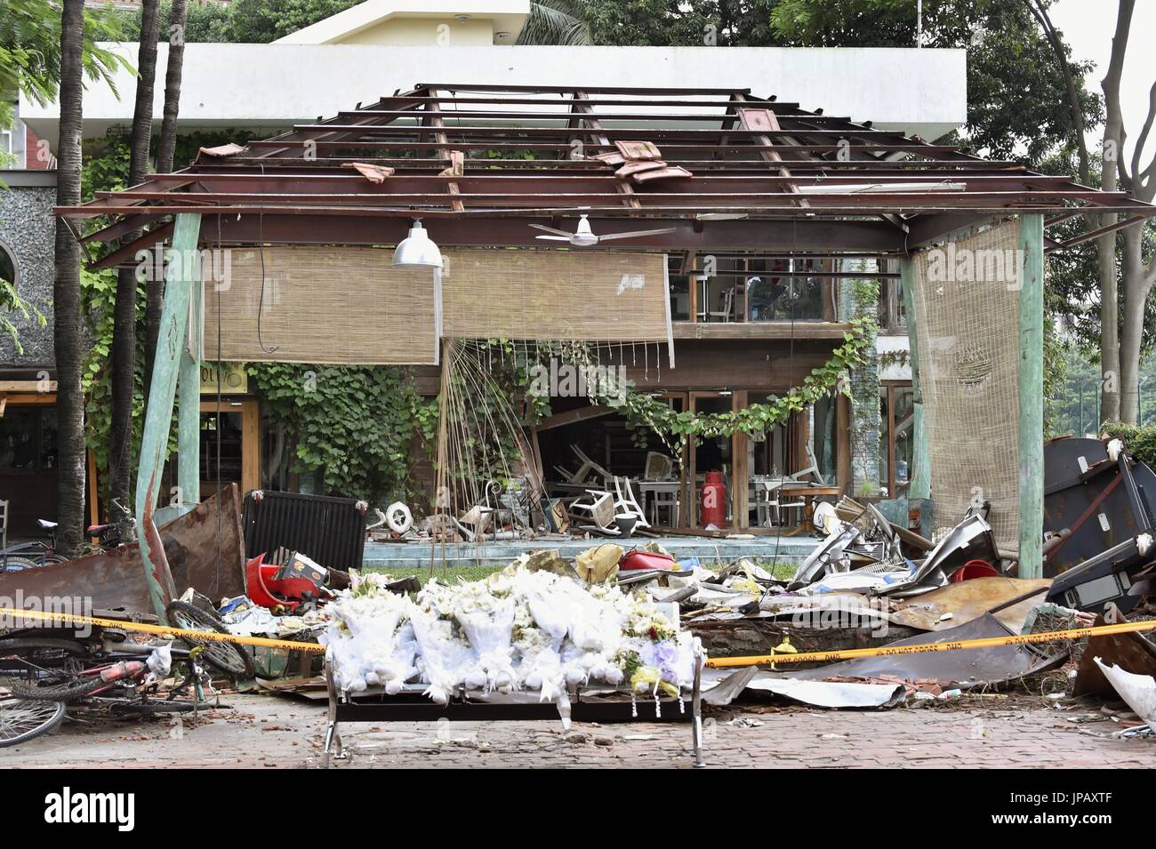 Flowers have been left in front of the Holey Artisan Bakery cafe in ...