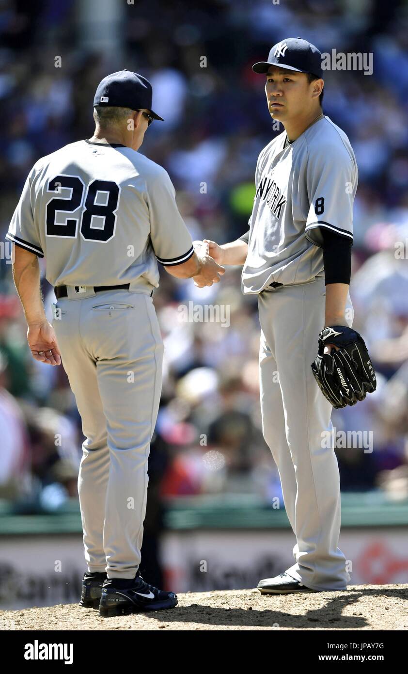 New York Yankees manager Joe Girardi (L) talks to starter Masahiro ...