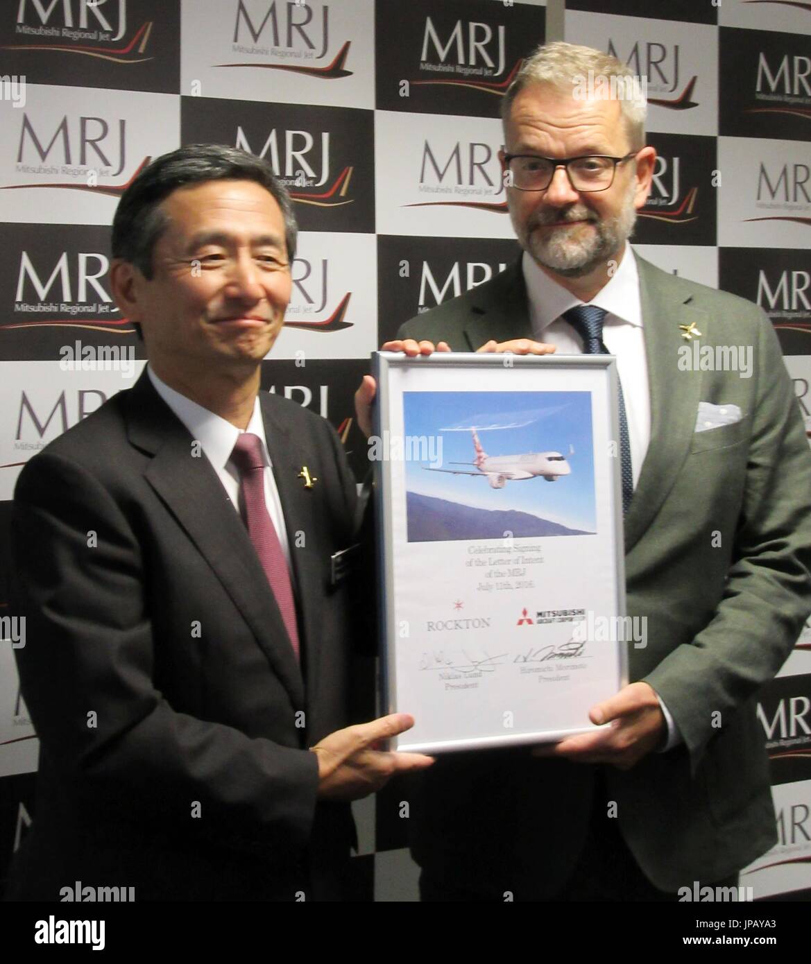 Mitsubishi Aircraft Corp President Hiromichi Morimoto (L) and Niklas ...