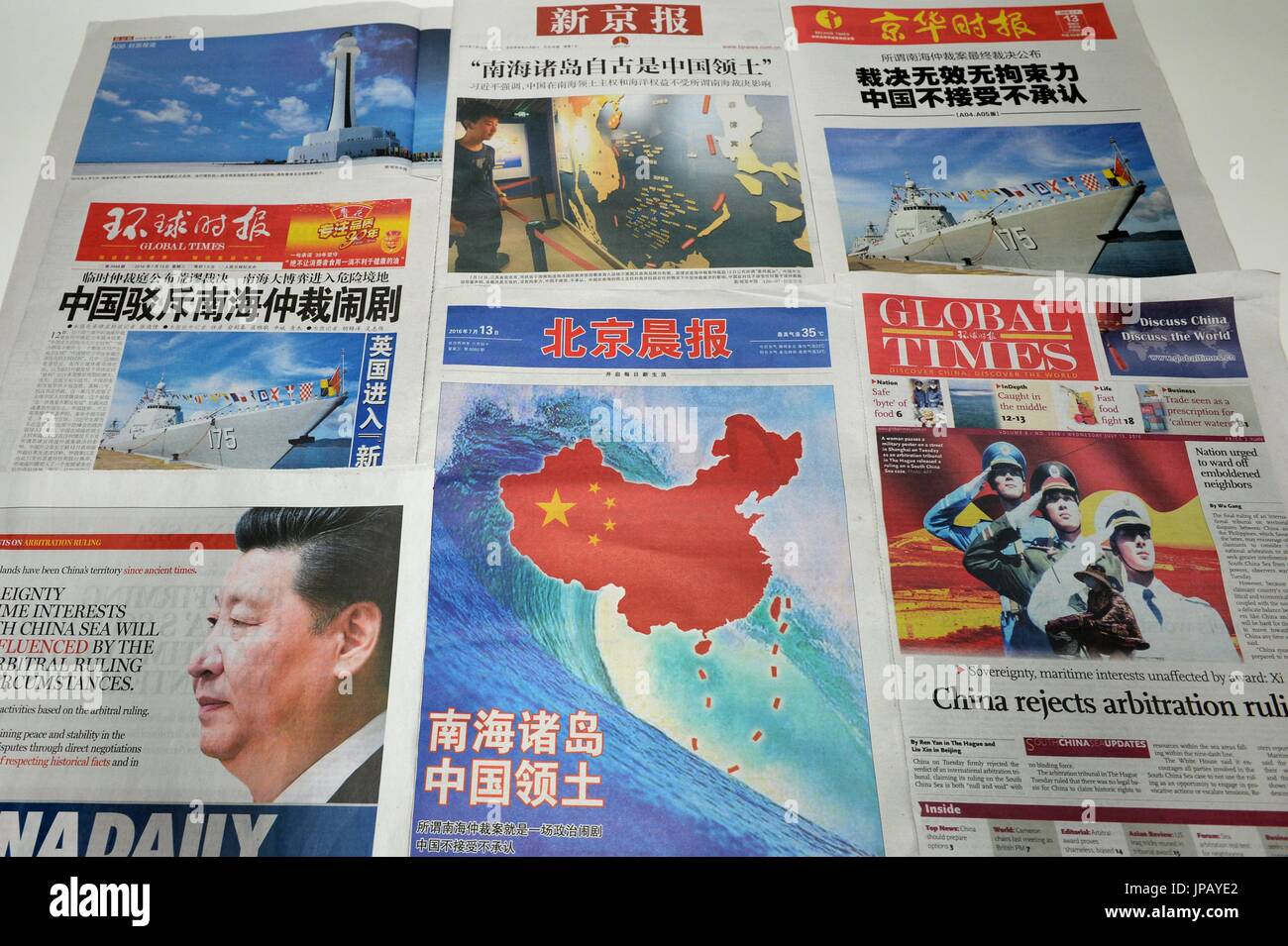 Photo shows Chinese newspapers' July 13, 2016, editions, which reported ...