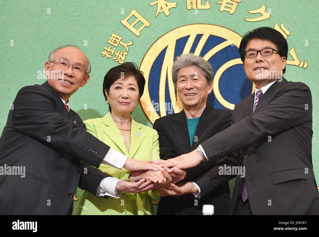 Four likely candidates for Tokyo governor put their hands together ...