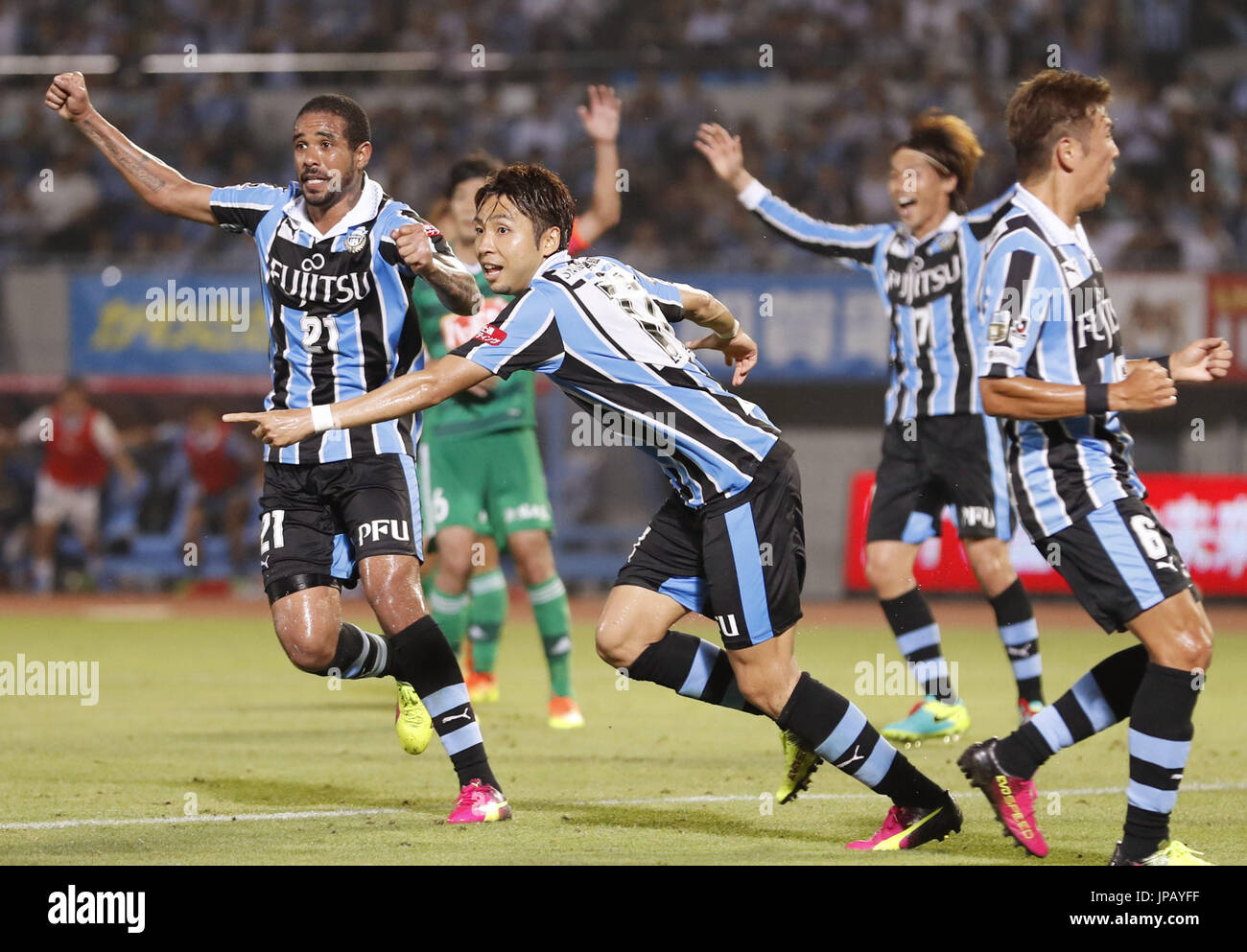 Yu Kobayashi (2nd from L) celebrates after striking the winner deep in ...