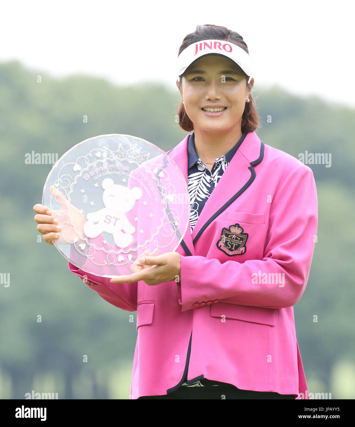 South Korea's Jeon Mi Jeong poses the winner's trophy after her victory ...