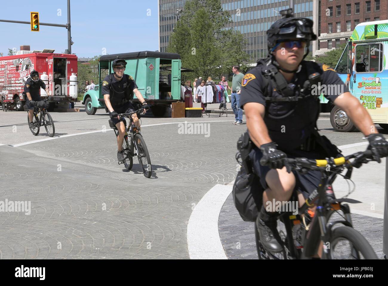 Police officers on bicycles patrol in Cleveland on July 20, 2016 as the ...