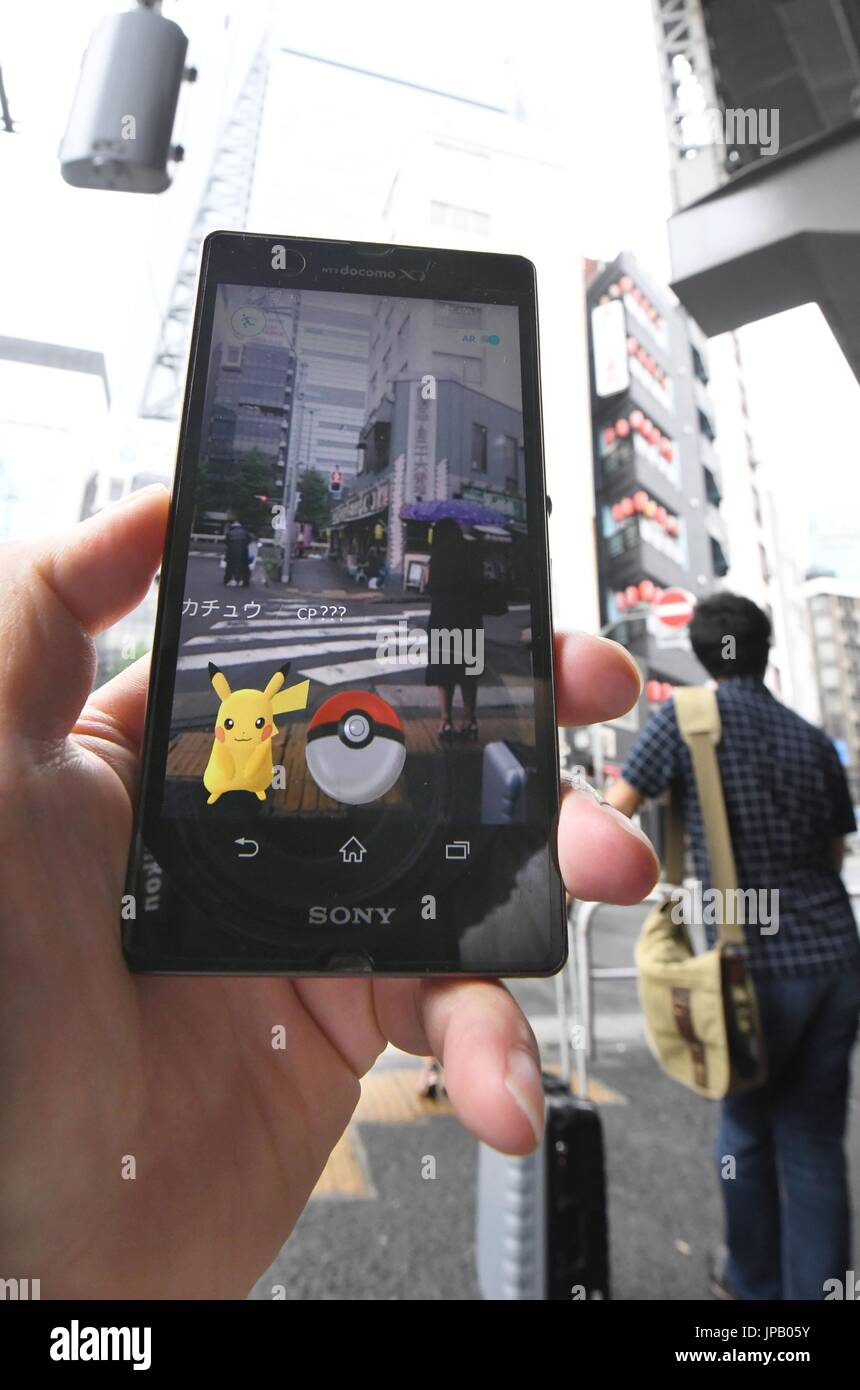Pikachu appears on a mobile phone screen as a user plays the smash-hit ...