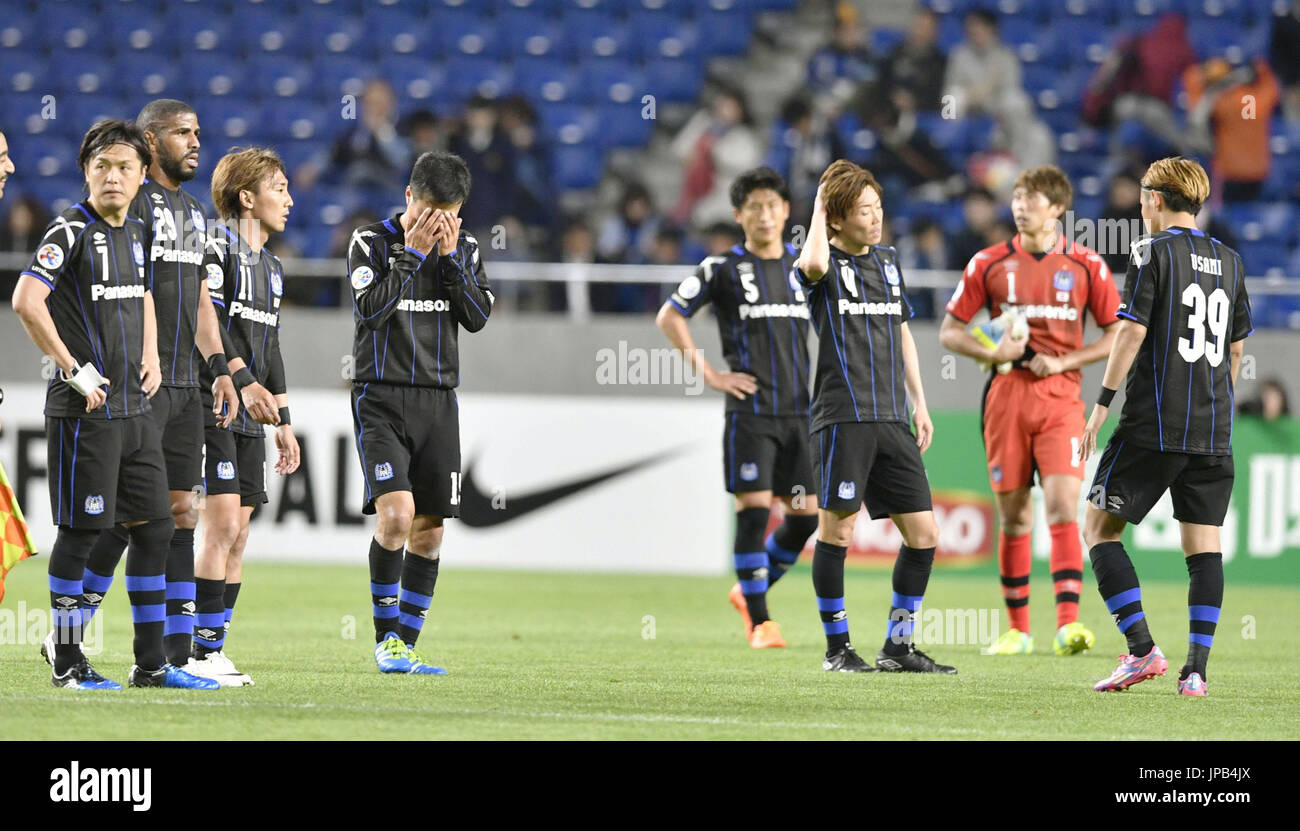 Players of Japan's Gamba Osaka react after their 2-1 loss to South ...