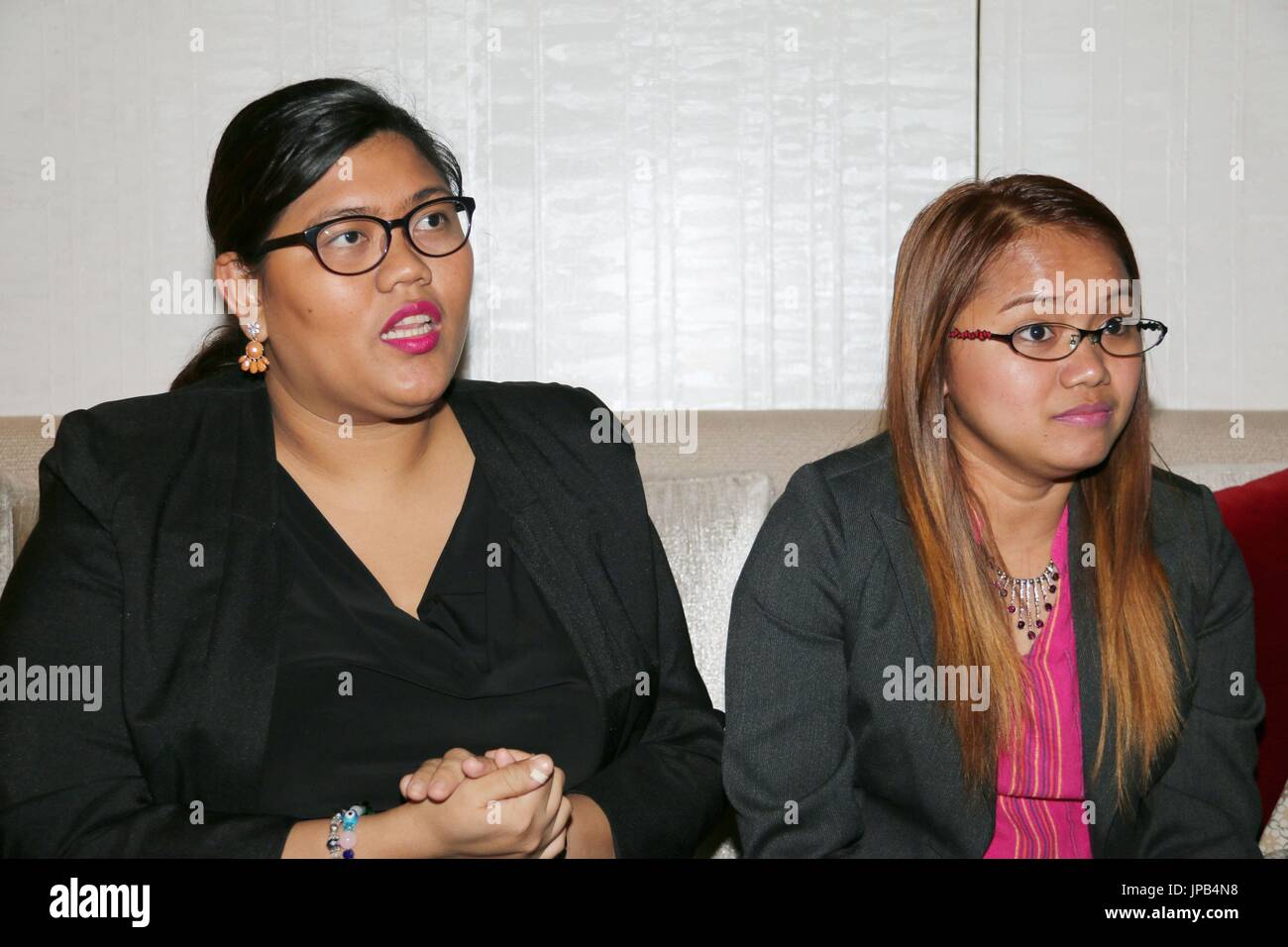 Filipino caregivers Aira Ignacio (L) and Bernadette Villanueva are interviewed by Kyodo News in ...