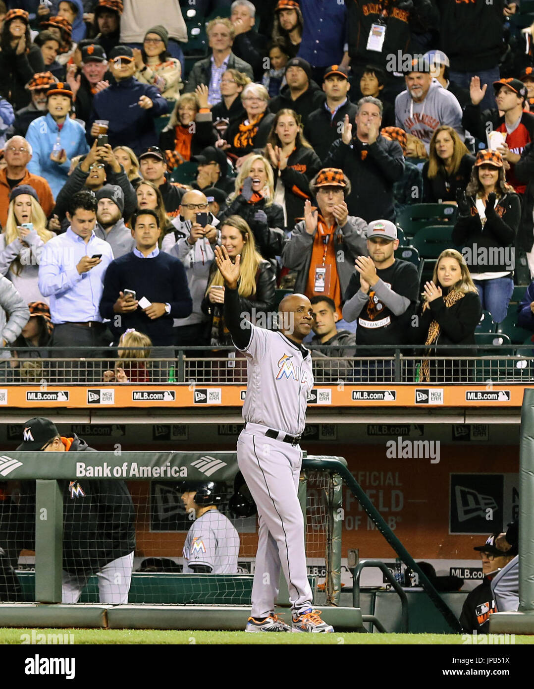 Miami Marlins hitting coach Barry Bonds waves to the crowd during a ...