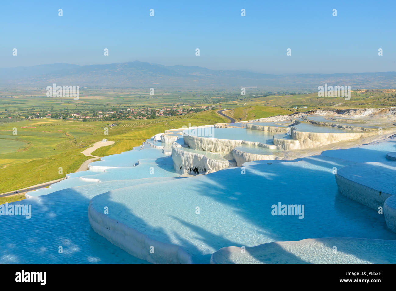 The enchanting pools of Pamukkale in Turkey. Pamukkale contains hot ...