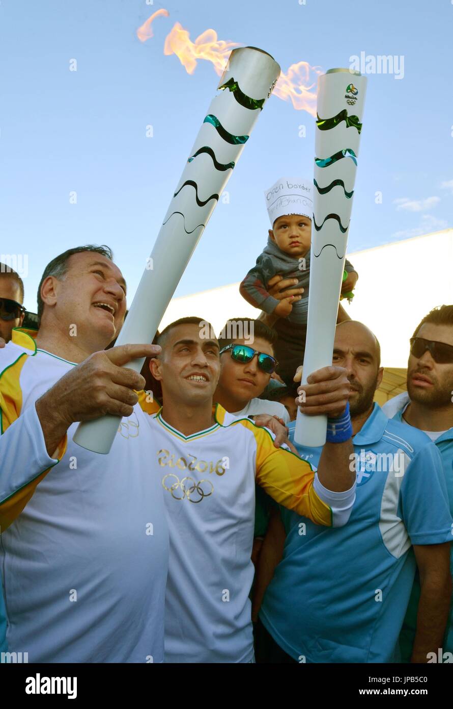 Syrian refugee Ibrahim al-Hussein (2nd from L), an athlete who lost ...