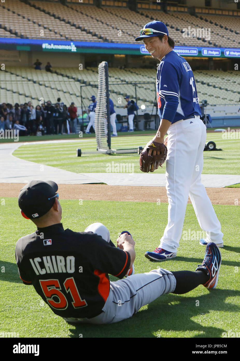 Los Angeles Dodgers pitcher Kenta Maeda (R) and Miami Marlins outfielder Ichiro Suzuki chat ...