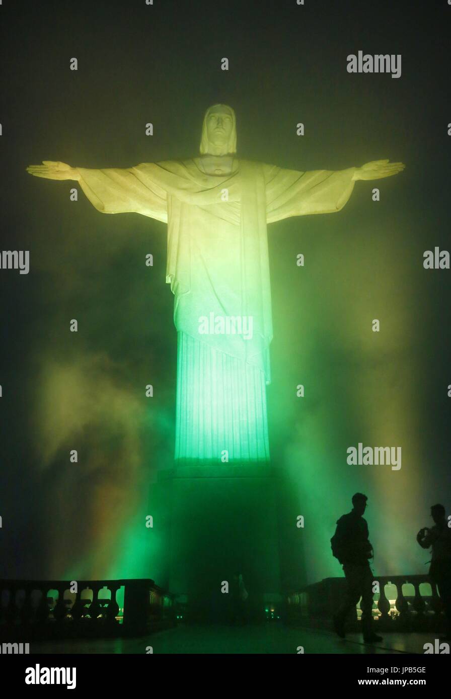 The Christ the Redeemer statue in Rio de Janeiro is illuminated in ...
