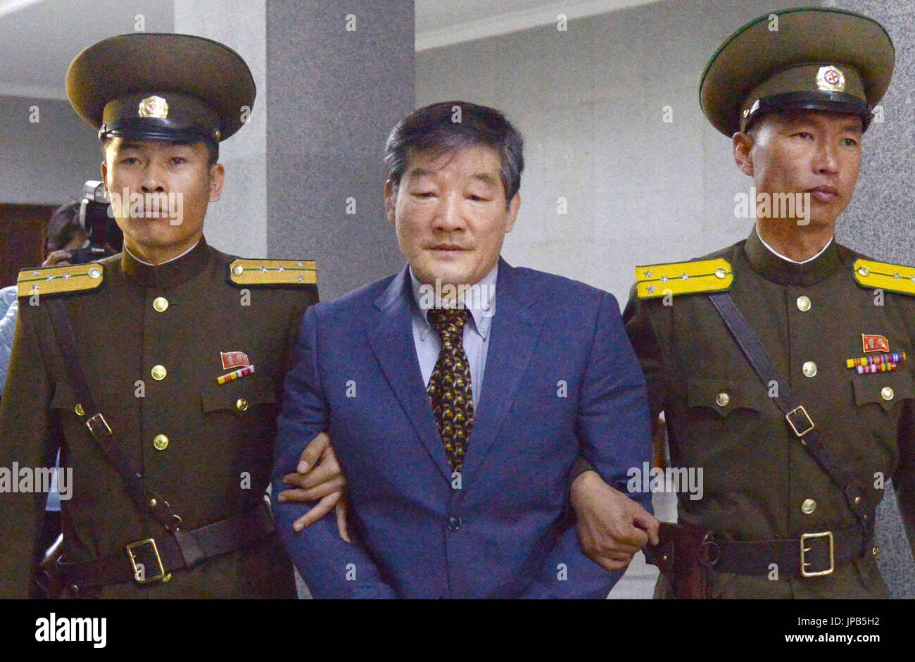 Kim Dong Chul (C), a Korean-American man, heads to a courtroom ahead of ...