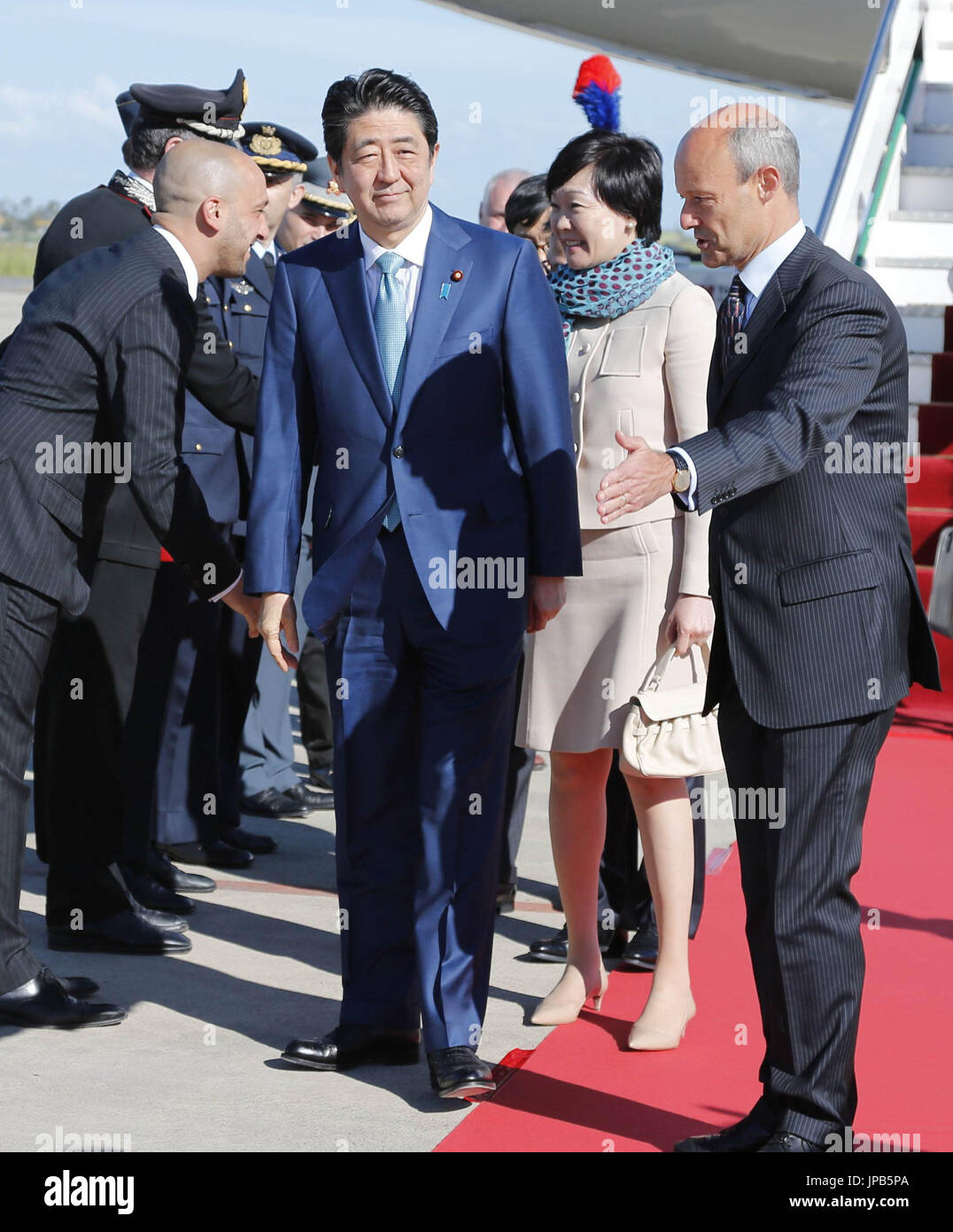 Japanese Prime Minister Shinzo Abe (C) and his wife Akie (behind him ...