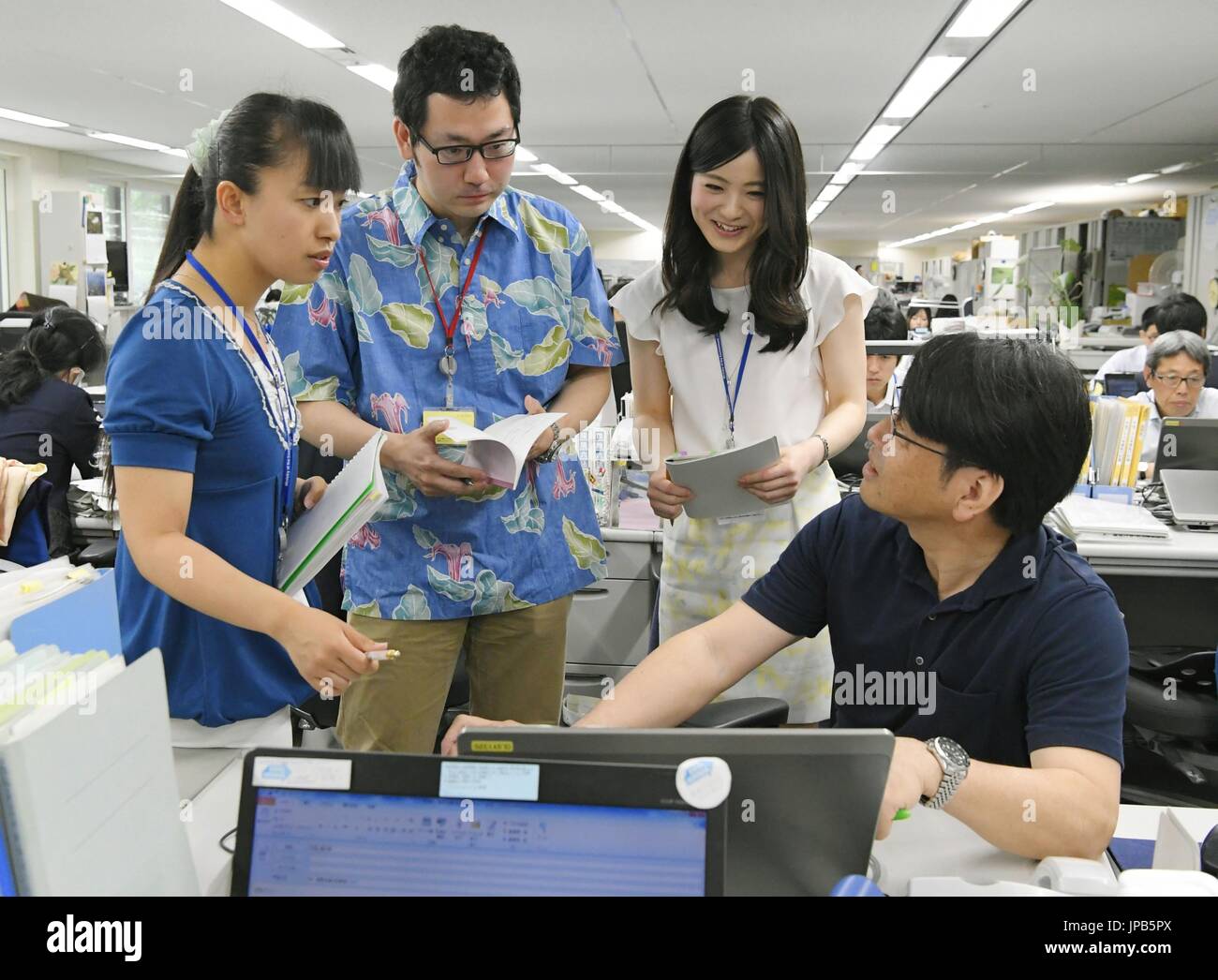 Personnel at the Environment Ministry's Global Environment Bureau work ...