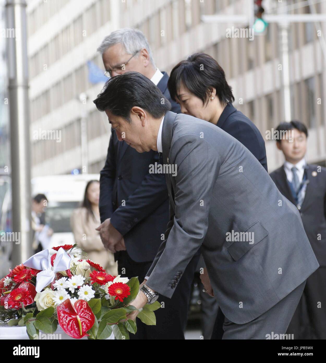 Japanese Prime Minister Shinzo Abe (front) and his wife Akie (2nd from ...
