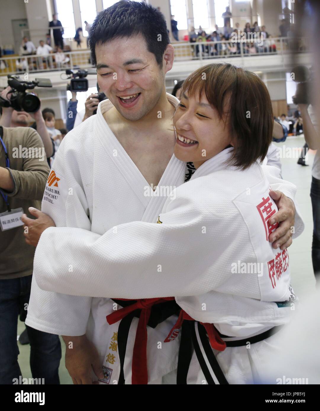 Visually impaired judo player Haruka Hirose (L) and his wife Junko Hirose celebrate as they each ...