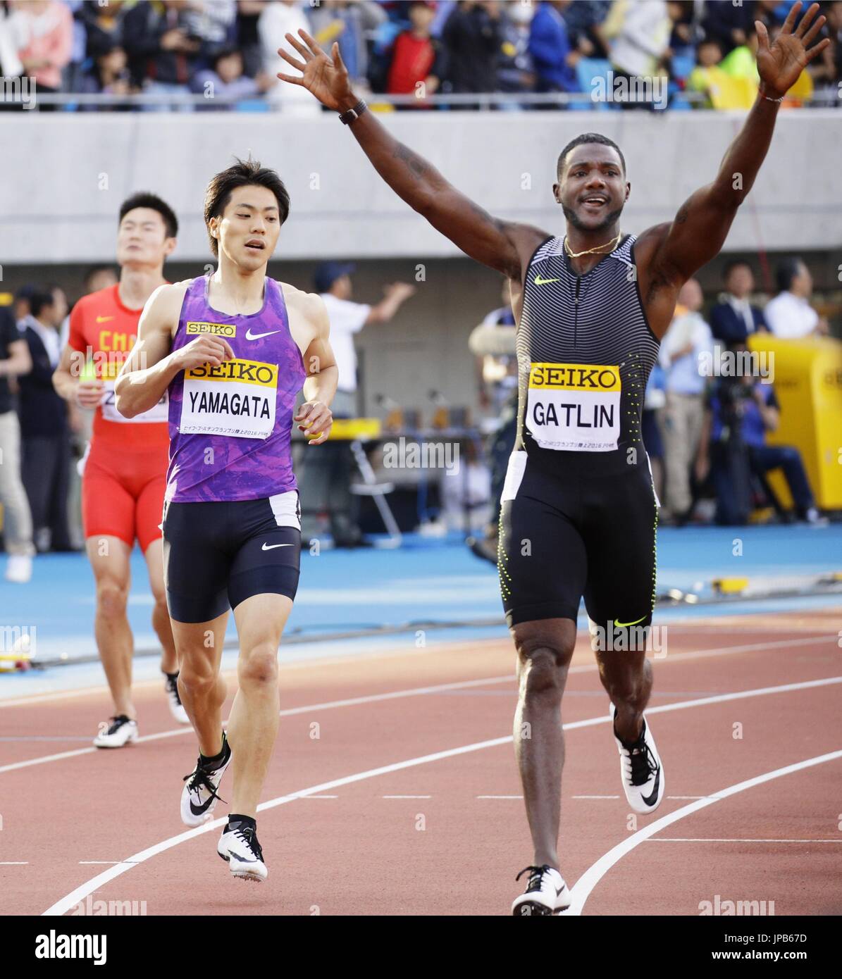 Justin Gatlin (R) of the United States celebrates after winning the men ...
