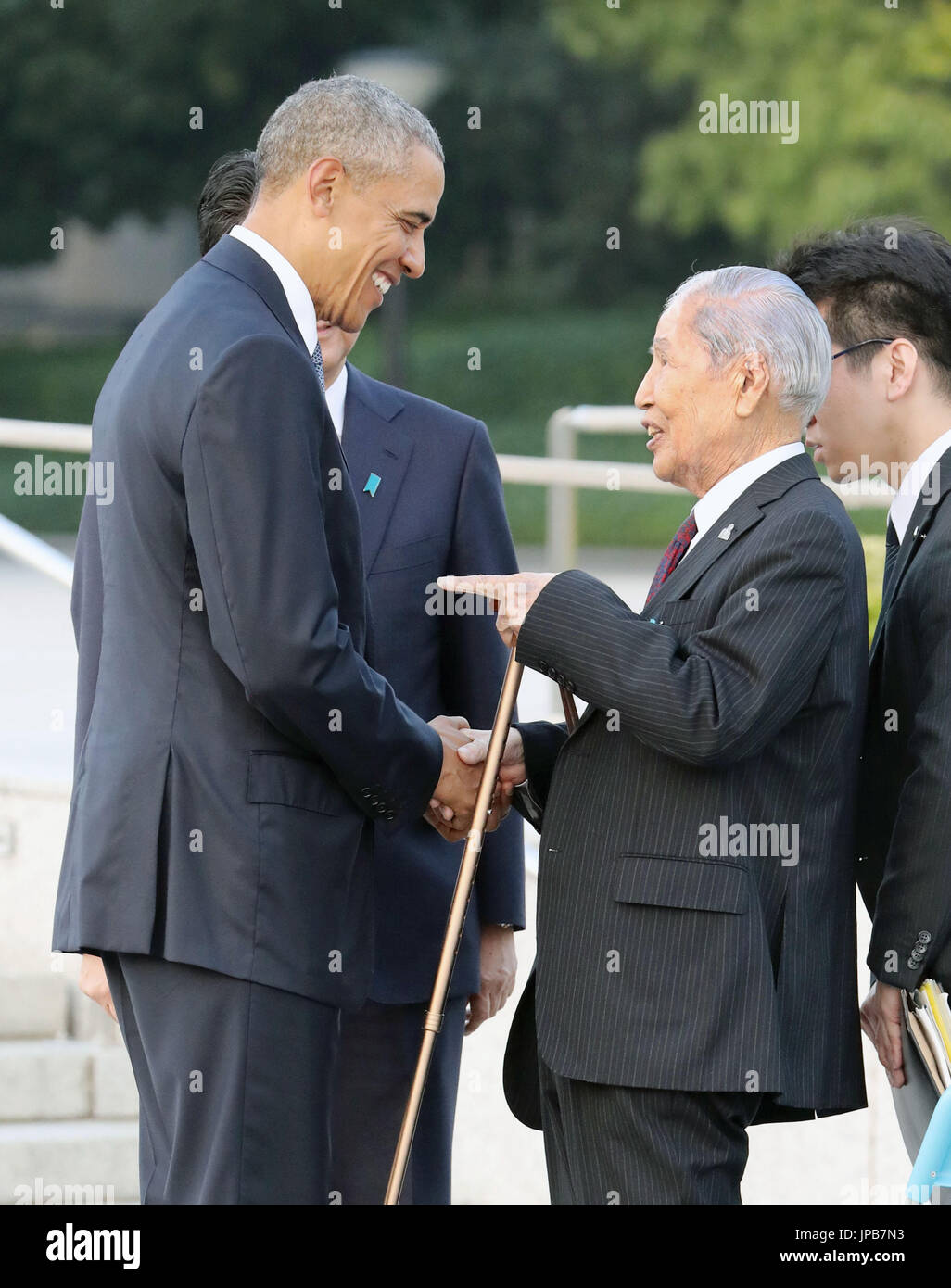 U.S. President Barack Obama (L) shakes hands with Sunao Tsuboi, a 91 ...
