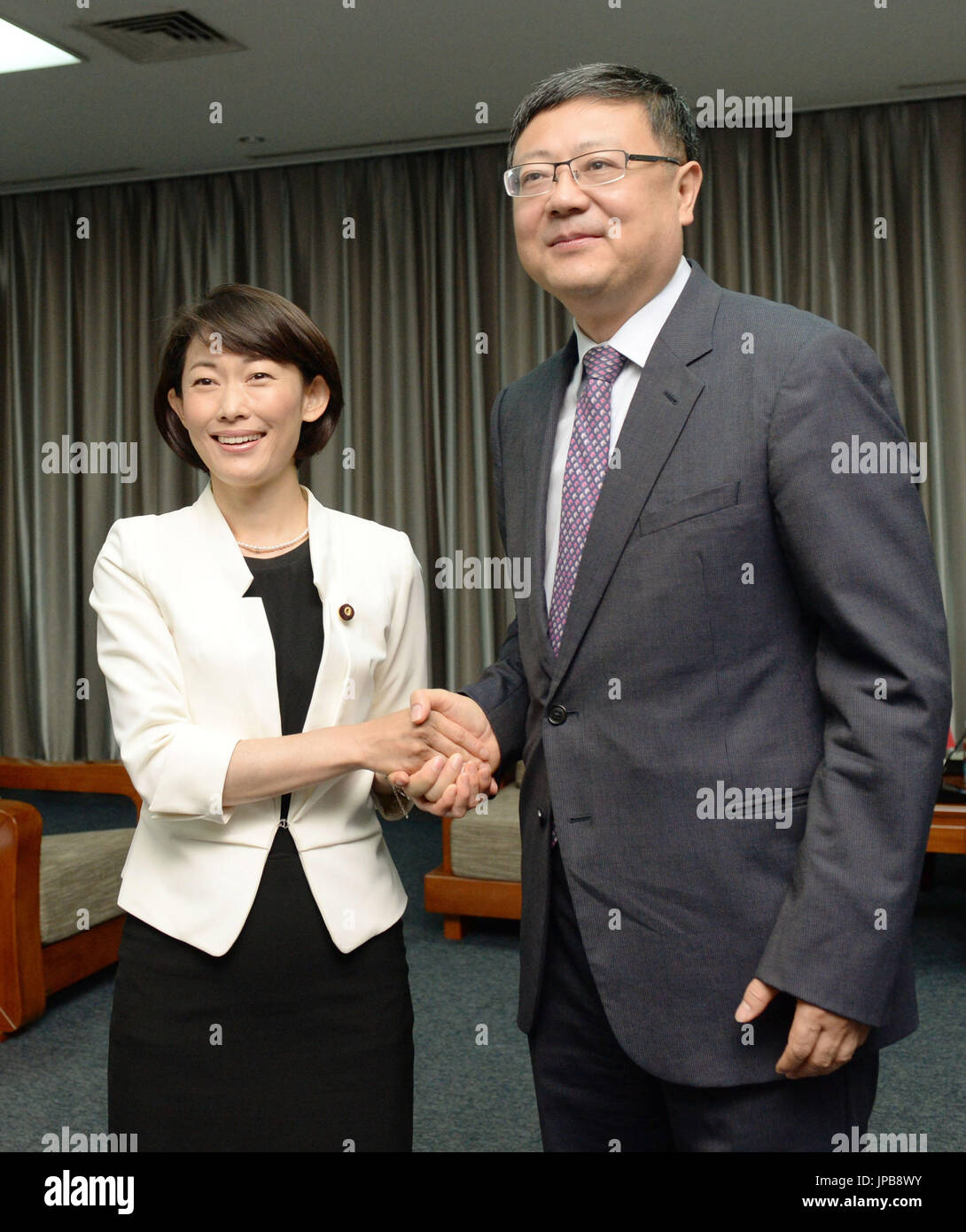 Japanese Environment Minister Tamayo Marukawa (L) meets with her Chinese counterpart Chen Jining ...