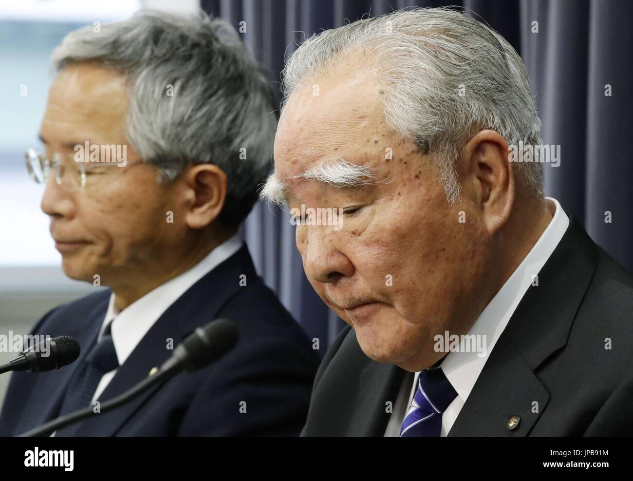 Suzuki Motor Corp. Chairman Osamu Suzuki (R) and Vice President Osamu ...