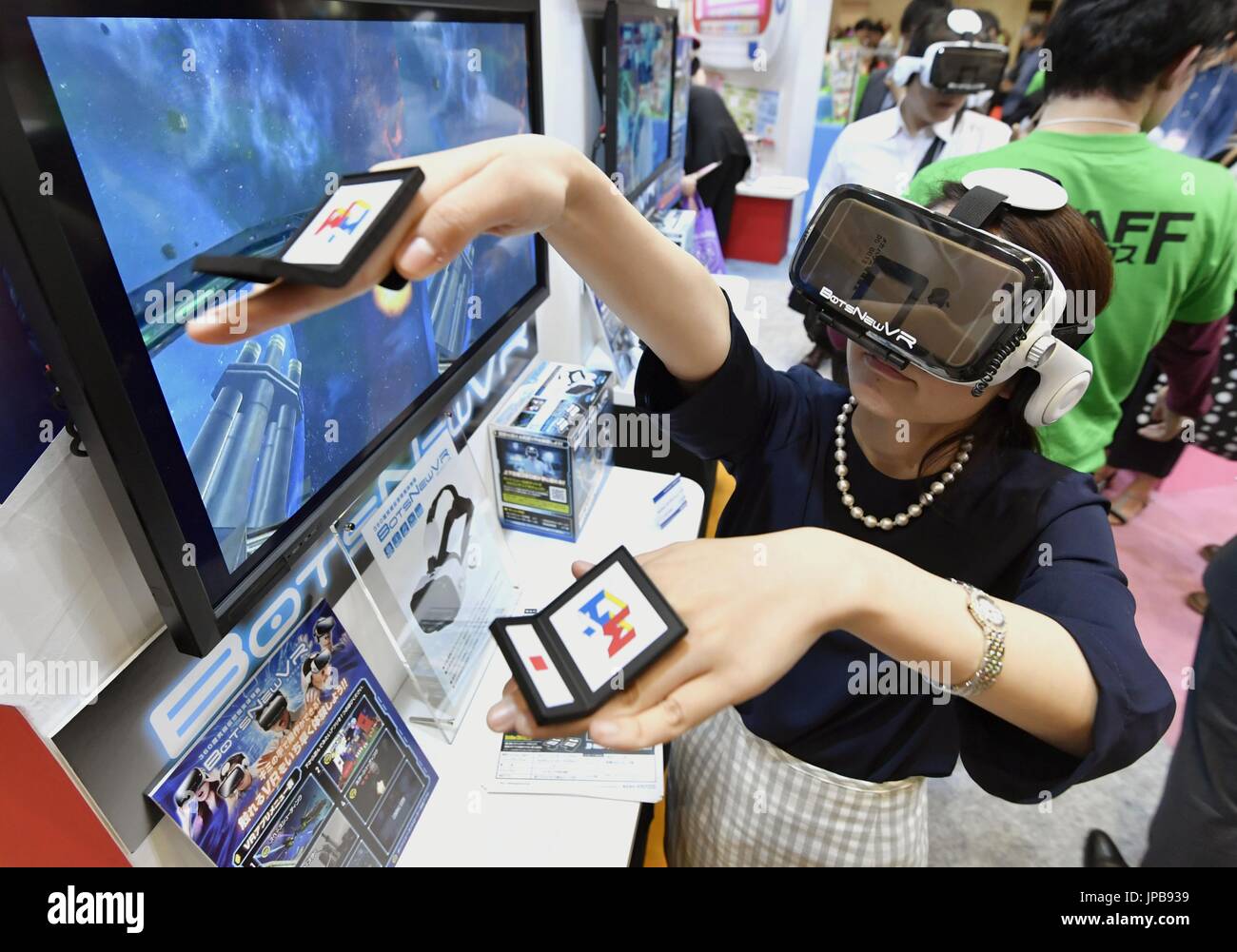 A visitor plays a virtual reality video game at the International Tokyo ...