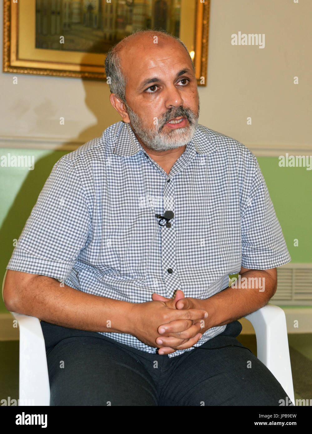 Adel Nefzi, spokesman of the Islamic Center of Fort Pierce, speaks to ...