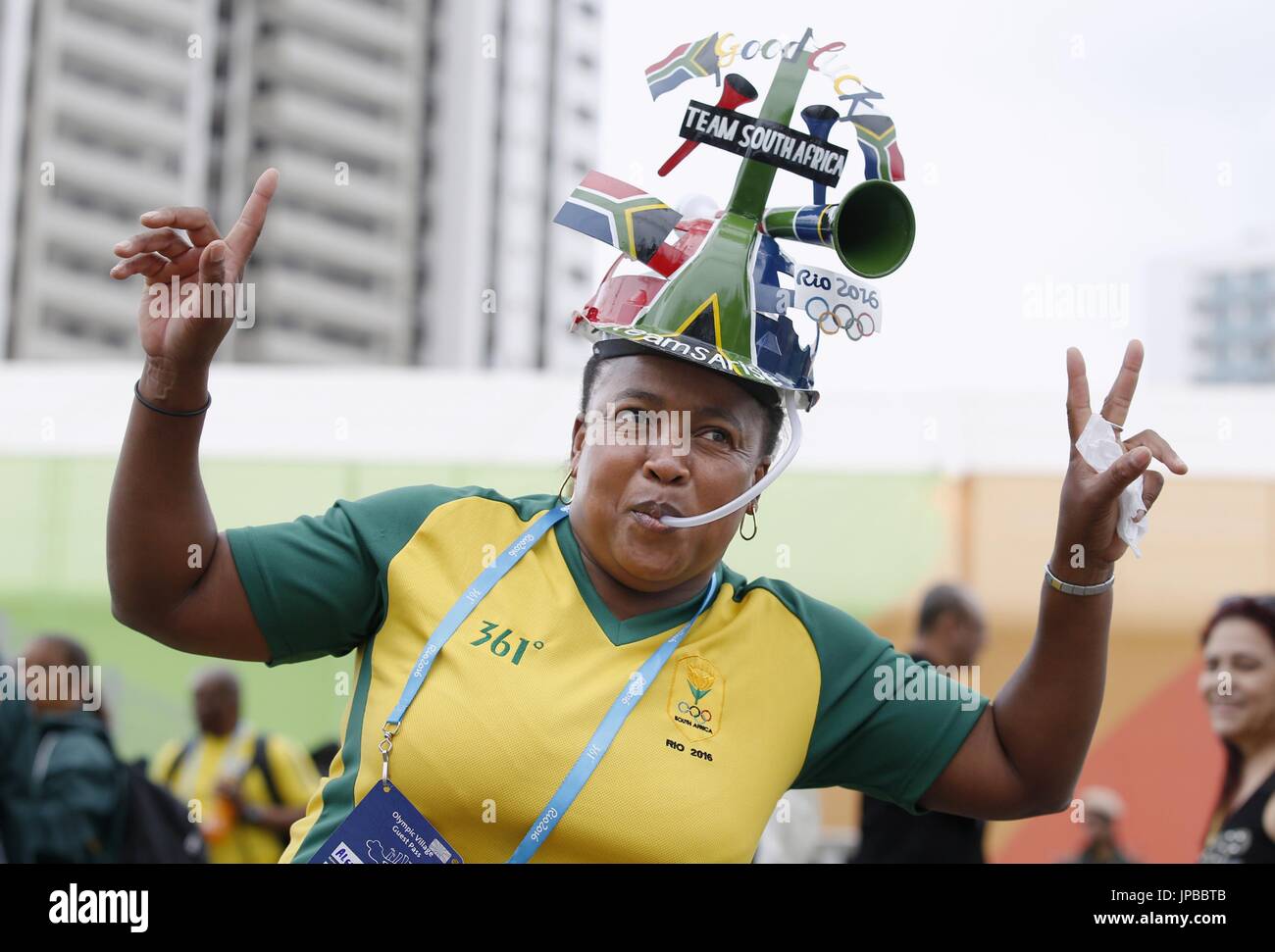 An official of South Africa's women's soccer team wears a "makarapa," a ...