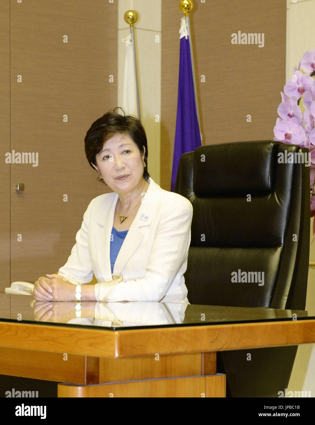 Newly elected Tokyo Gov. Yuriko Koike poses for photos at her office in ...