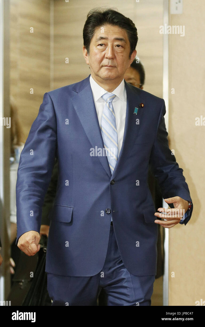 Prime Minister Shinzo Abe arrives at the headquarters of the ruling ...