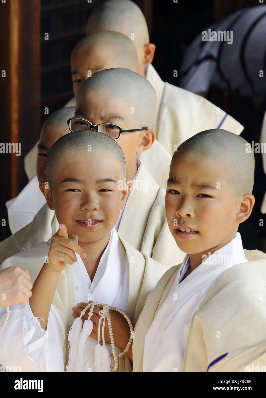 Children attend a ceremony to become Buddhist monks at Higashi Honganji ...