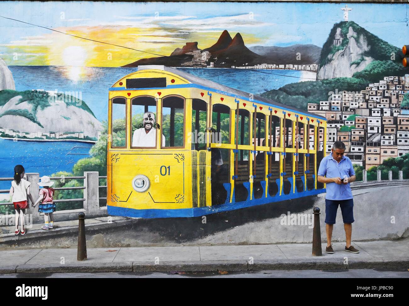 A mural showcasing sightseeing spots in Rio de Janeiro is seen painted ...