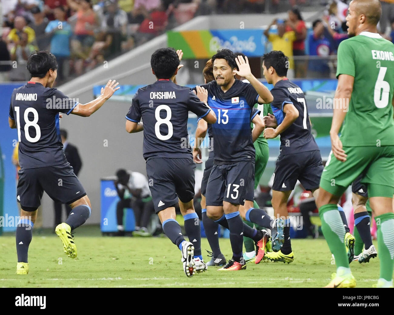 Shinzo Koroki (13) of Japan celebrates with teammates after scoring ...