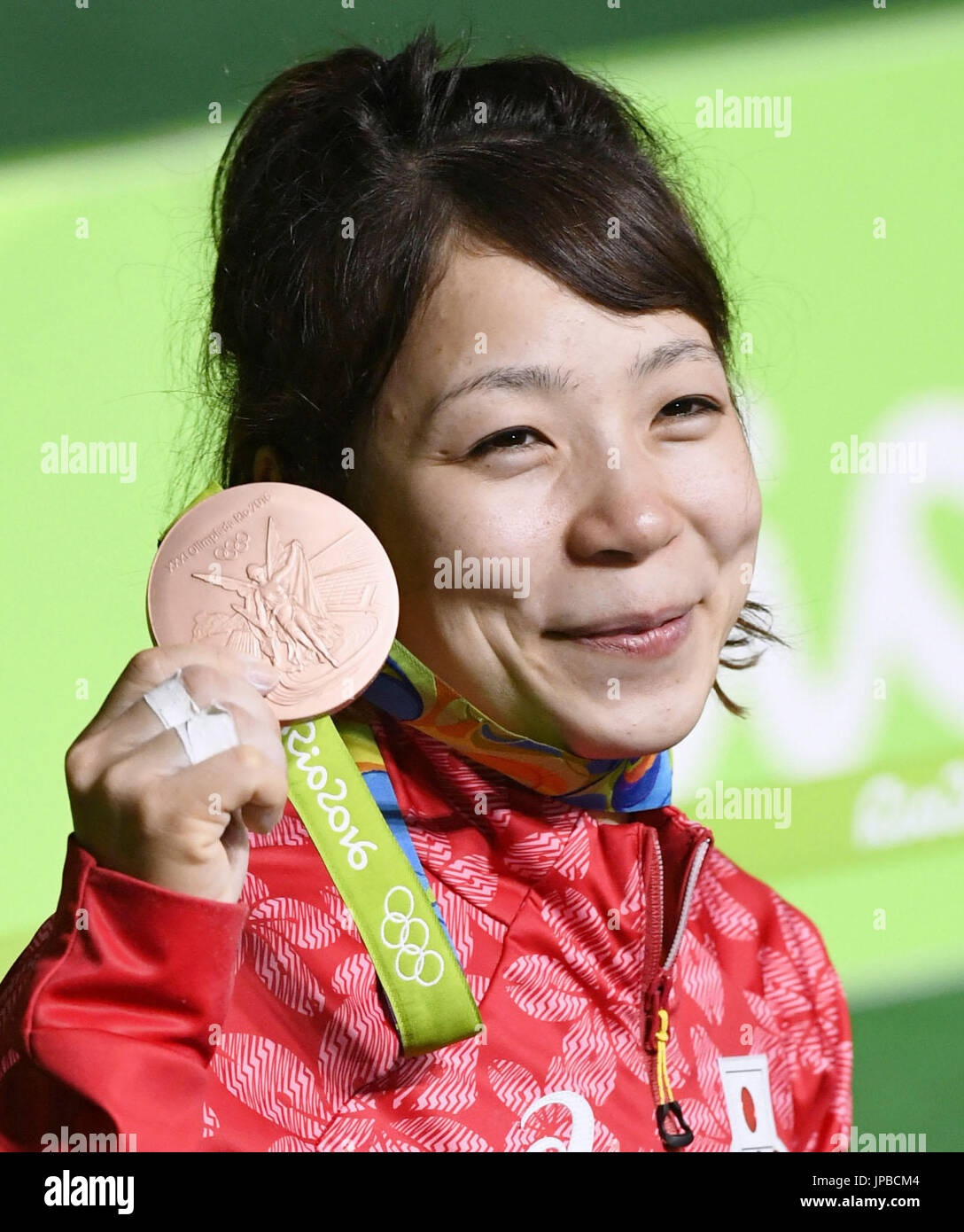 Japanese weightlifter Hiromi Miyake poses with her bronze medal after ...