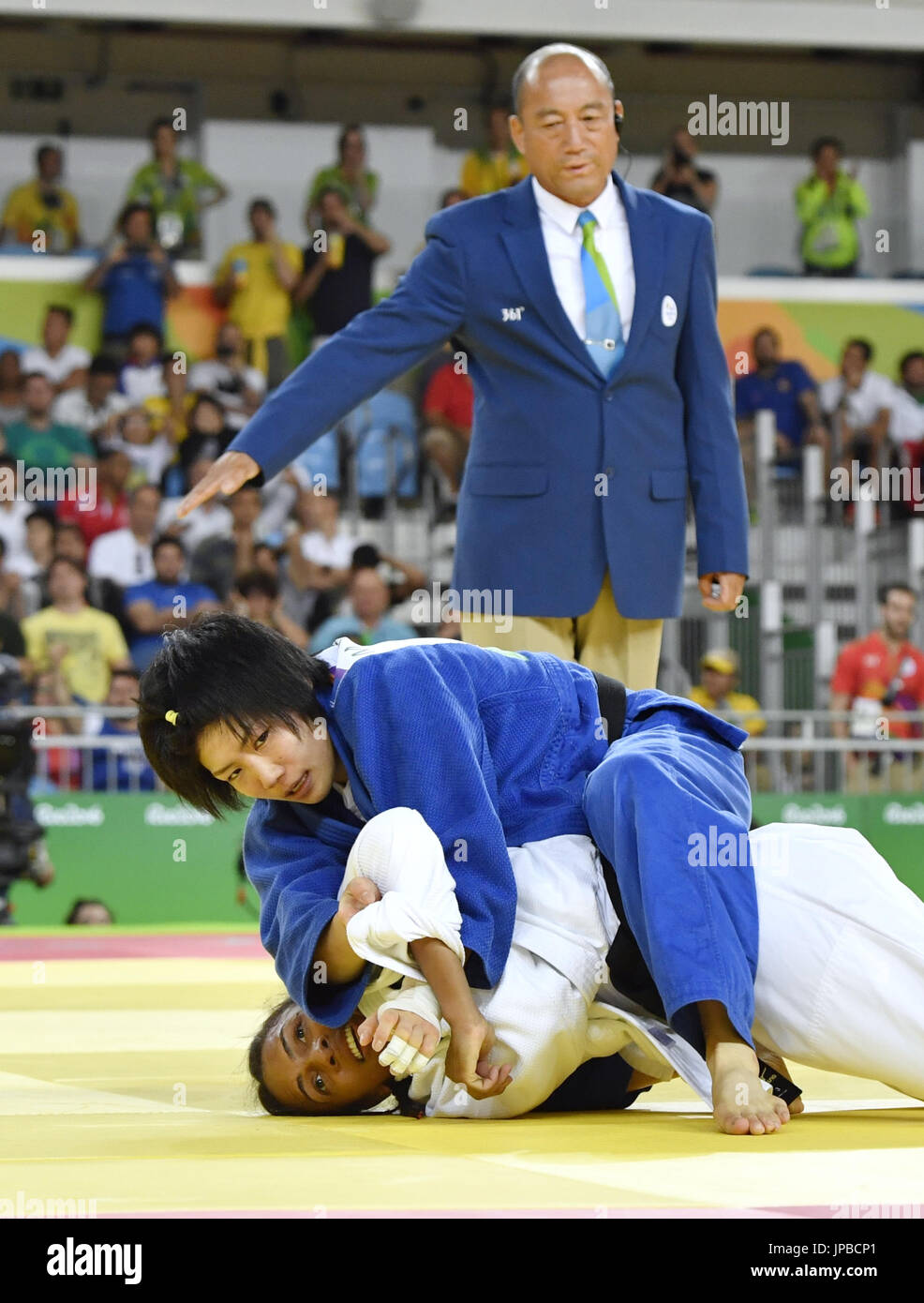 Japan's Misato Nakamura (blue) fights with Erika Miranda of Brazil in a ...