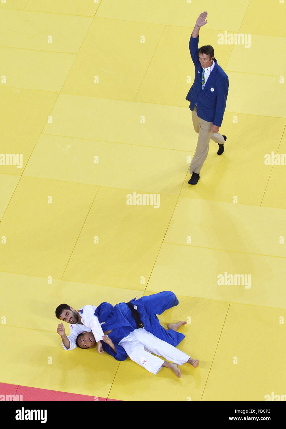 Japan's Masashi Ebinuma wins the men's 66-kilogram bronze medal with an ...