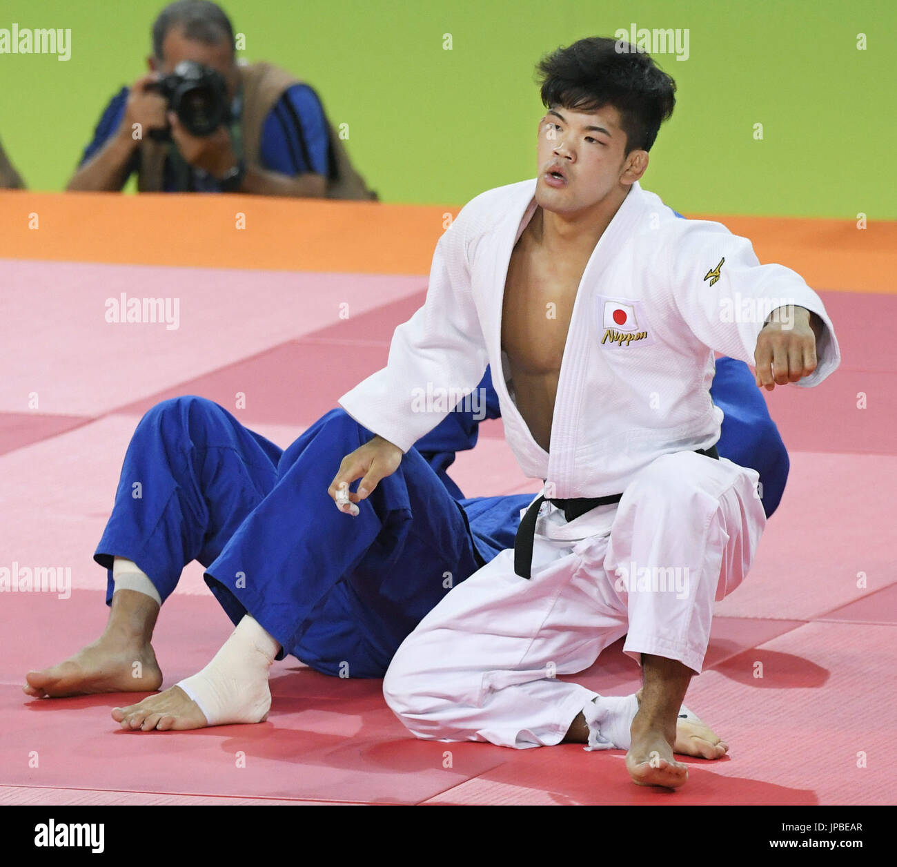 Shohei Ono (front) of Japan is seen after defeating Rustam Orujov of ...