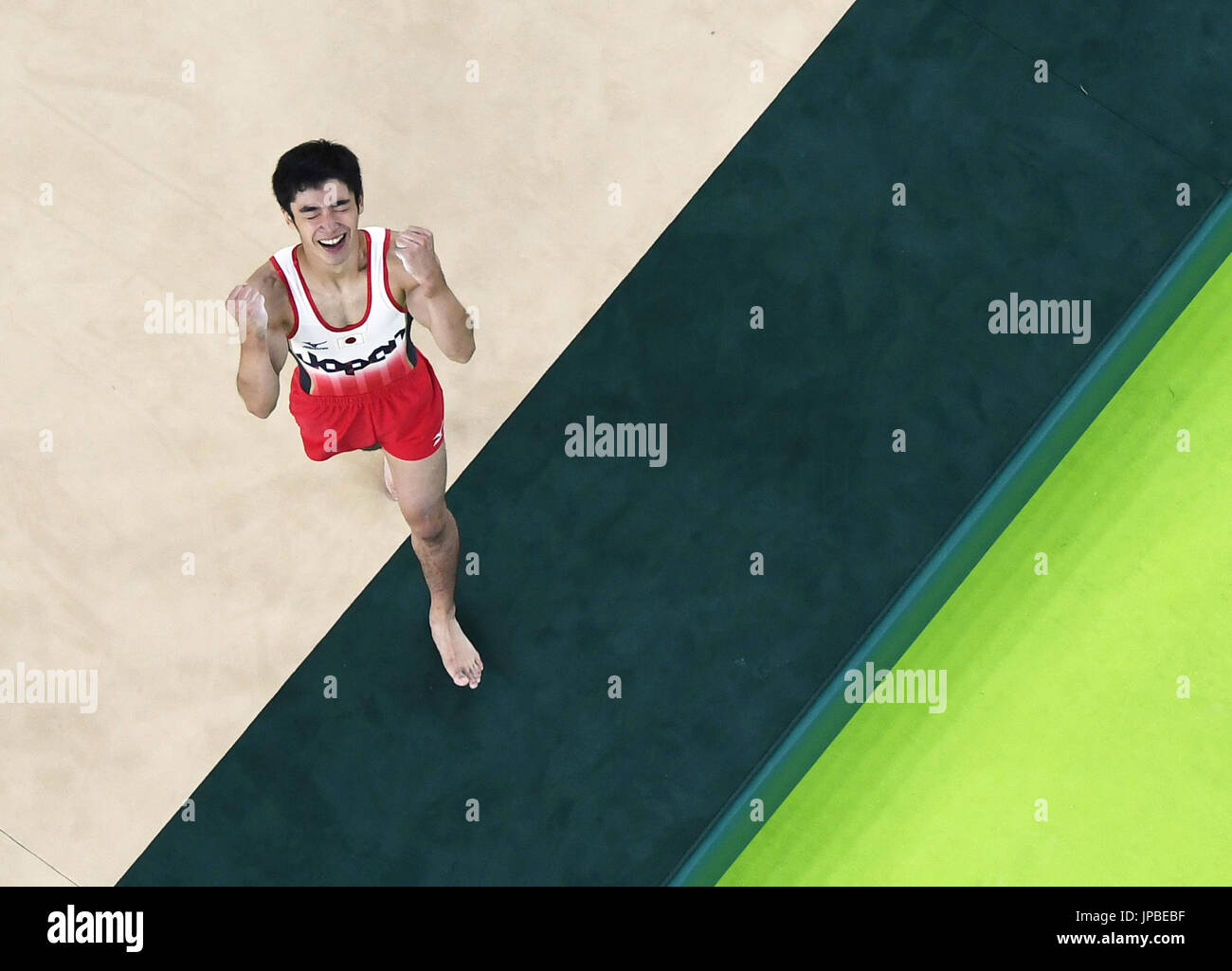 Japanese gymnast Kenzo Shirai pumps his fists after his floor exercise ...