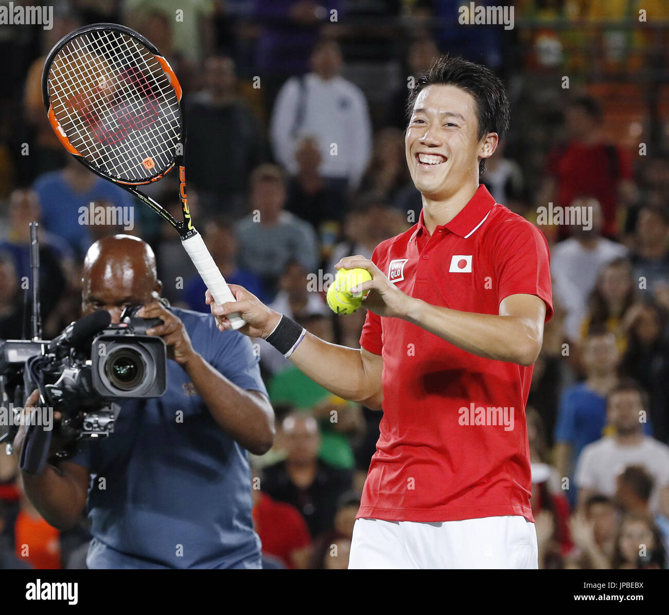 Japan's Kei Nishikori acknowledges the crowd after defeating John ...