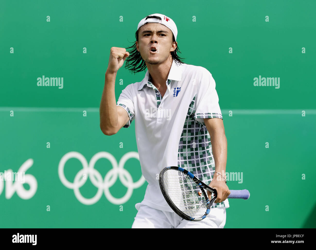 Japanese tennis player Taro Daniel pumps his fist as he wins a point in ...