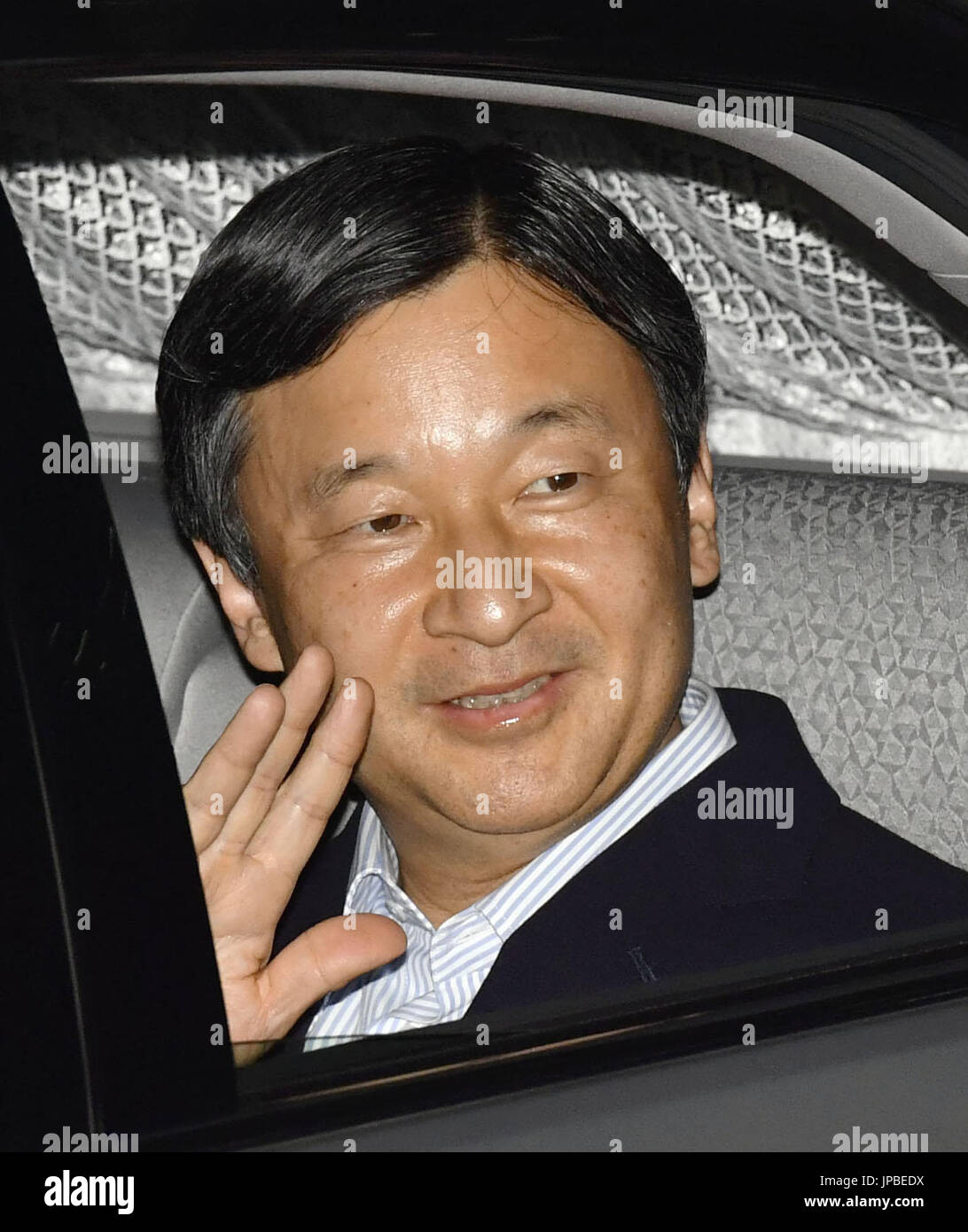 Japan's Crown Prince Naruhito waves as he is driven through the ...