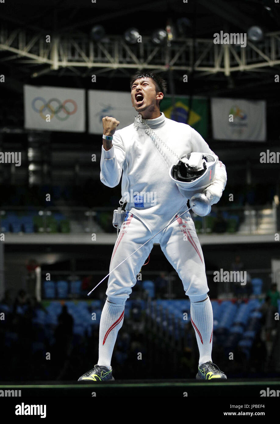 Japan's Kazuyasu Minobe celebrates after defeating Marco Fichera of ...