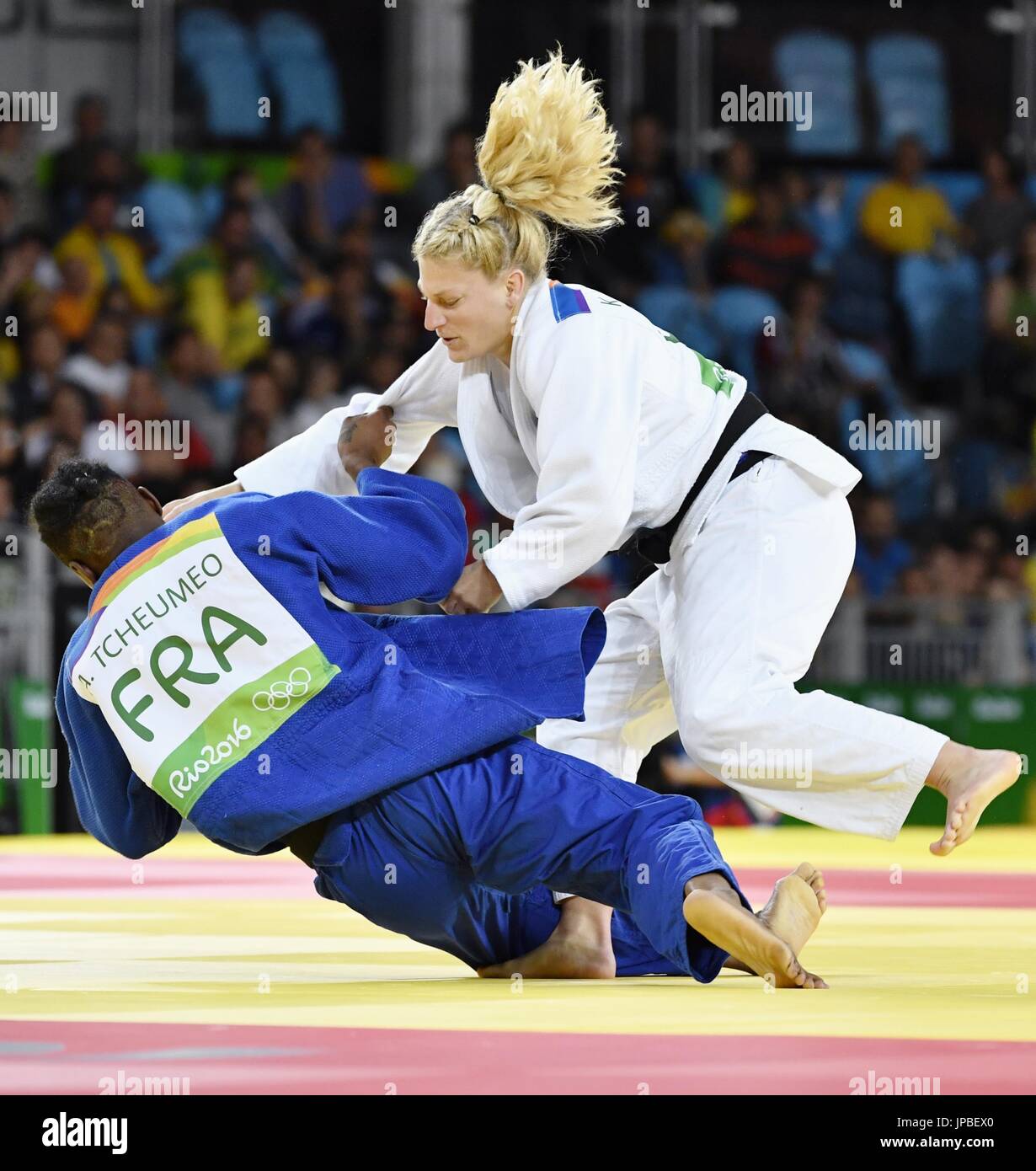 American judoka Kayla Harrison (R) and French Audrey Tcheumeo compete ...