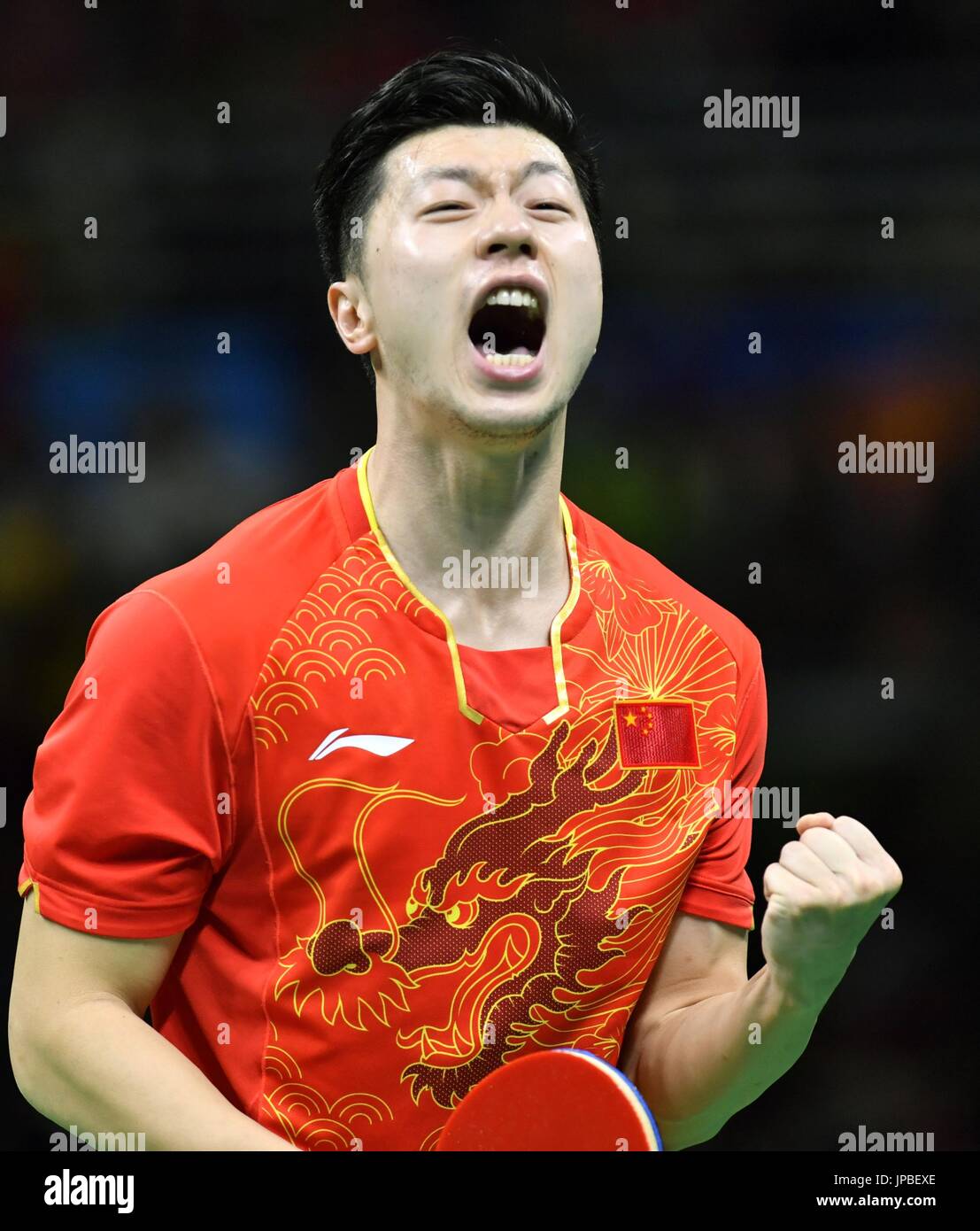 China's Ma Long celebrates after defeating compatriot Zhang Jike in the ...